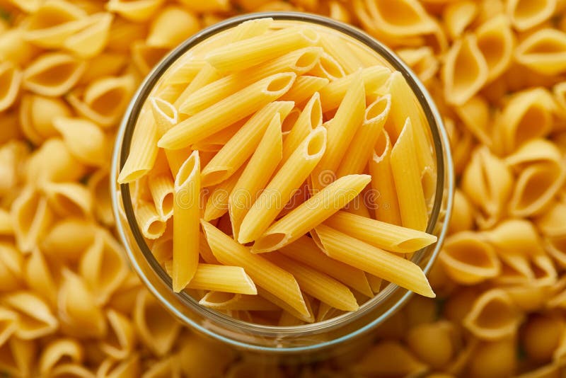 View of raw penne in jar stock photo. Image of tasty - 180946548