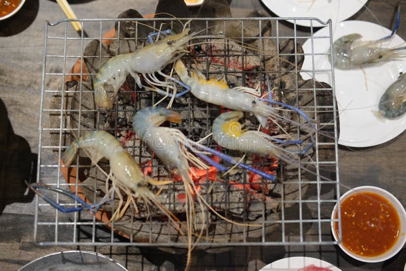 Raw Shrimps on Flaming Grill Stock Photo - Image of shrimp, prawn ...