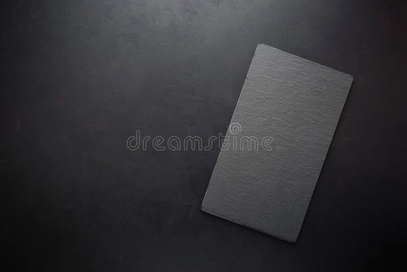 Top View on Rectangle Black Slate Plate on Rustic Dark Background. Copy ...