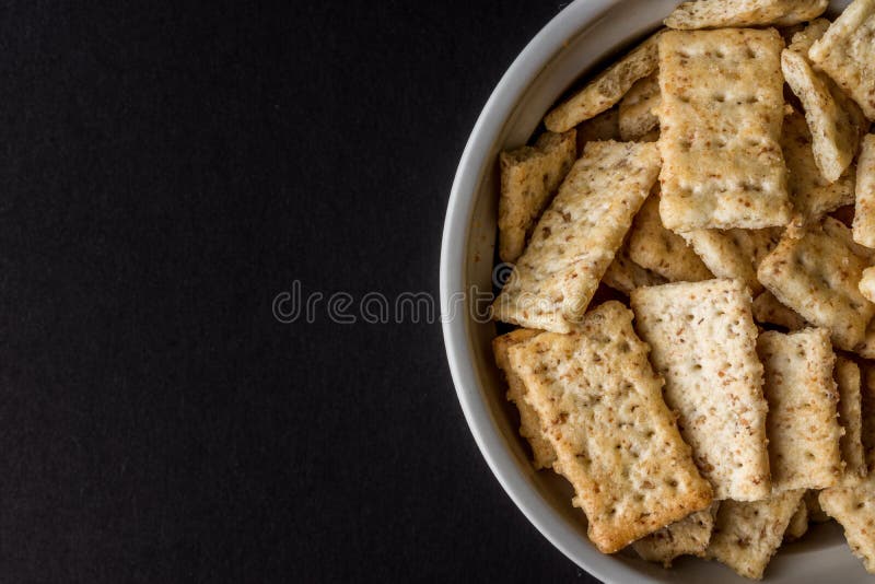Top View of Rectangular Crackers in the Bowl with Black Background ...