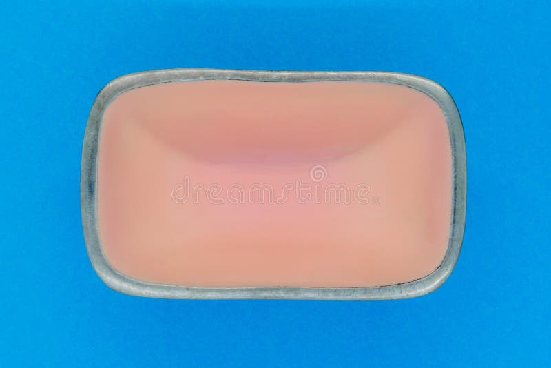 Top View of Rectangular Pink Empty Dish with Silver Edges on Blue ...