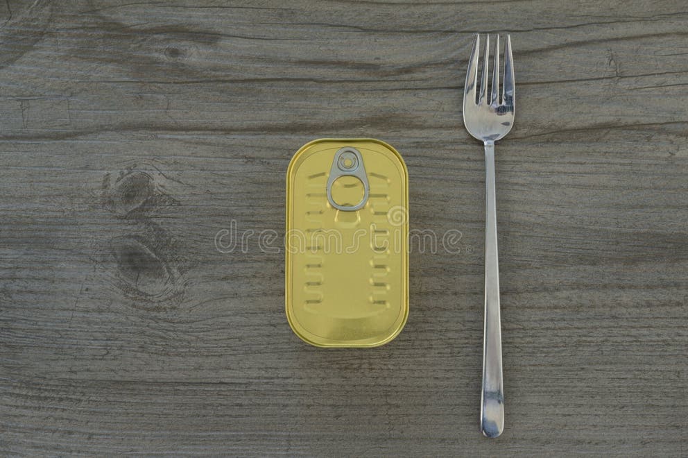 Top View of a Rectangular Tin Can and a Fork on a Wooden Table Stock ...