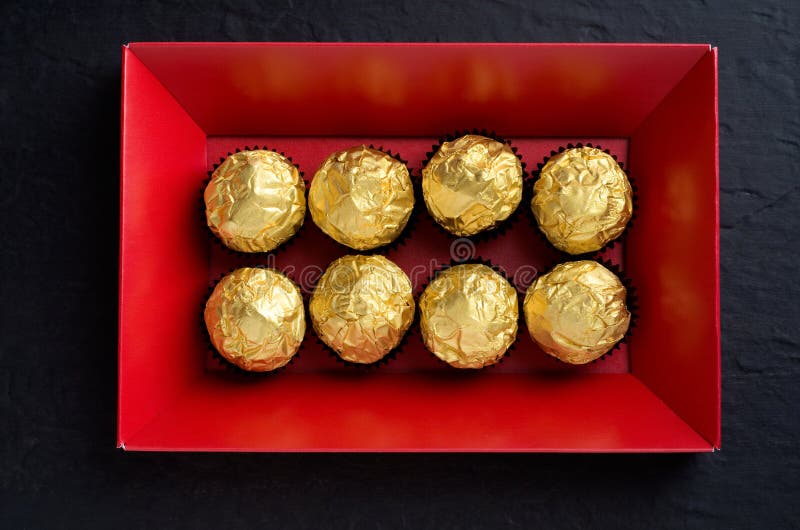 Top View of Red Box with Chocolate in Gold Wrapping Stock Photo - Image ...