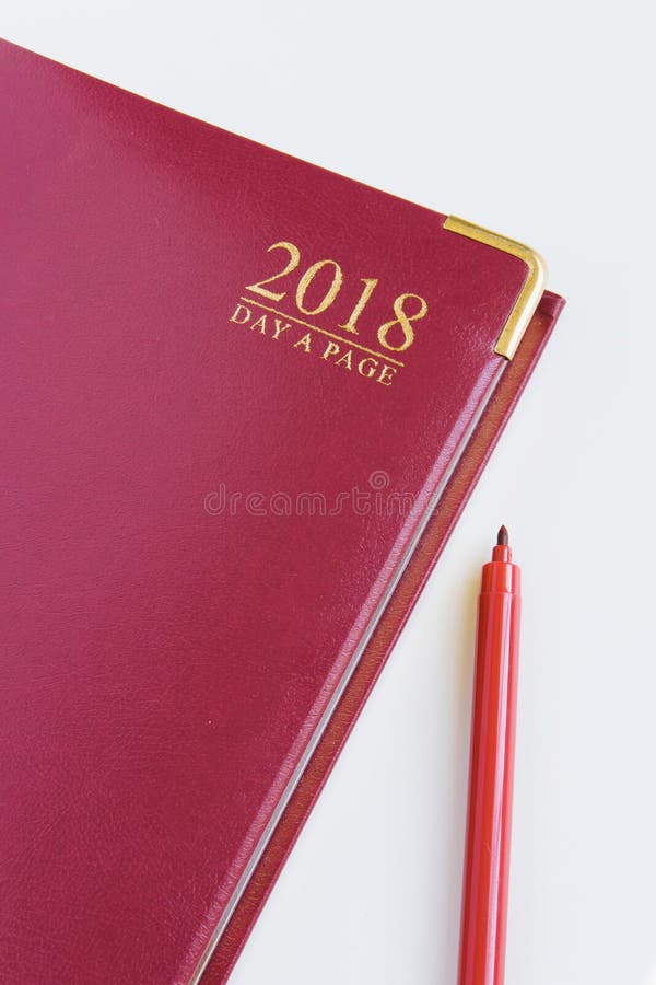 Top View of Red Diary for 2018 with Pen on White Background and Space ...
