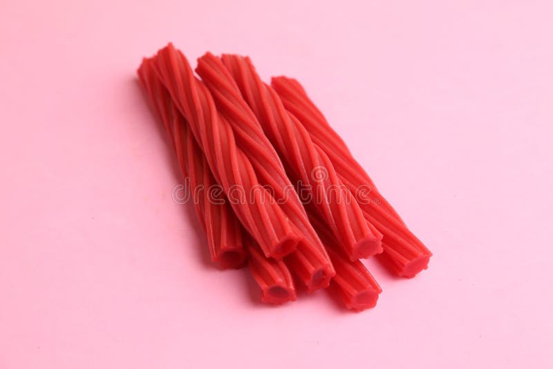 Top View of the Red Licorice Sticks on a Pink Background Stock Photo ...