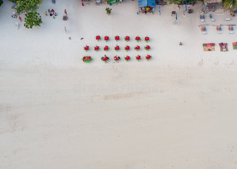 Top View of Red Tables and Green Chairs on the White Beach at ...