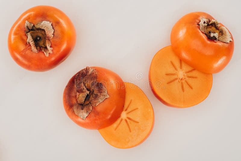 Top View of Ripe Cut Persimmons Stock Photo - Image of uncooked ...
