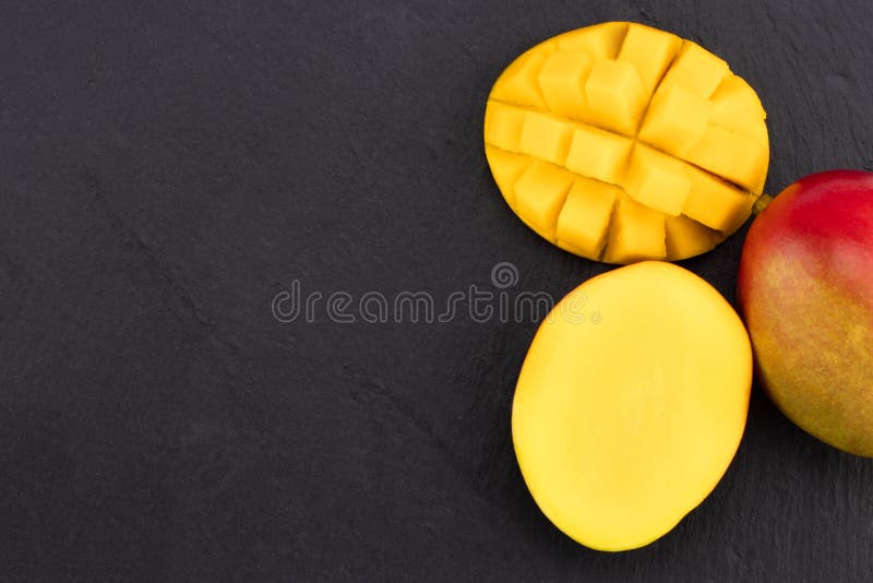 Top View of Ripe Mango Cut in Half and Diced on Dark Slate Stock Image ...