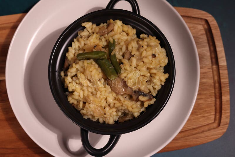 Top View of Risotto in a Small Pot with Wooden Board Stock Image ...