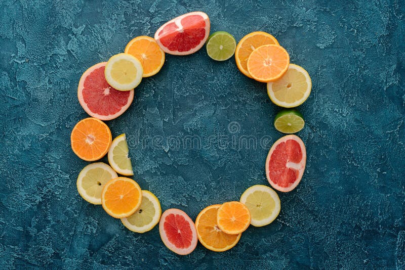 Top View of Round Frame Made of Citrus Fruits Slices on Blue Stock ...