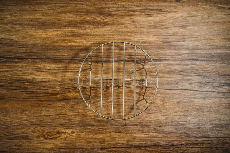 Top View of a Round Metal Grid on a Wooden Table. Stock Photo - Image ...