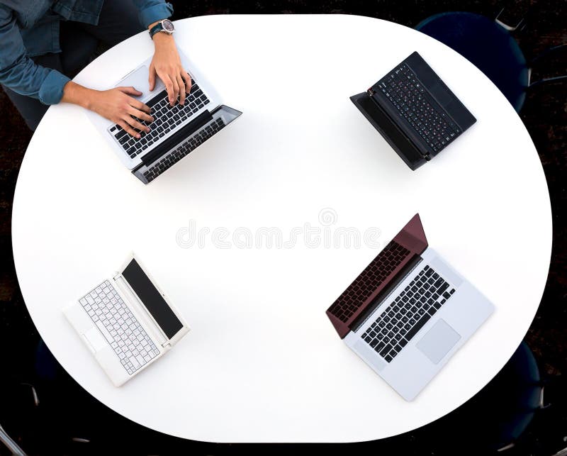 Top View of Rounded Desk with Four Laptops Stock Photo - Image of ...