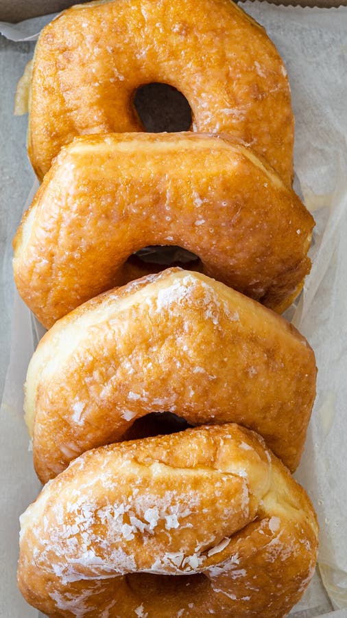 Top View of a Row of Freshly Baked Doughnuts Stock Image - Image of ...