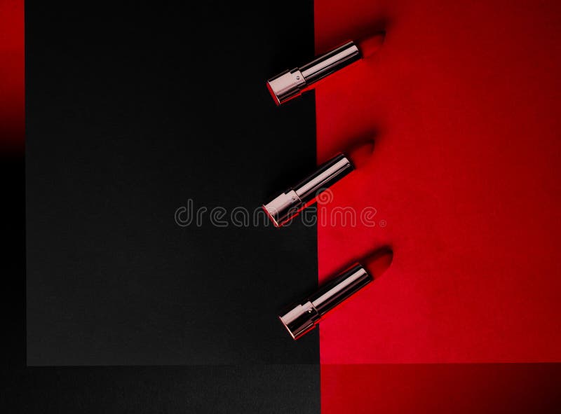 Top View of a Row of Open Red Lipsticks on a Red Black Surface Stock ...