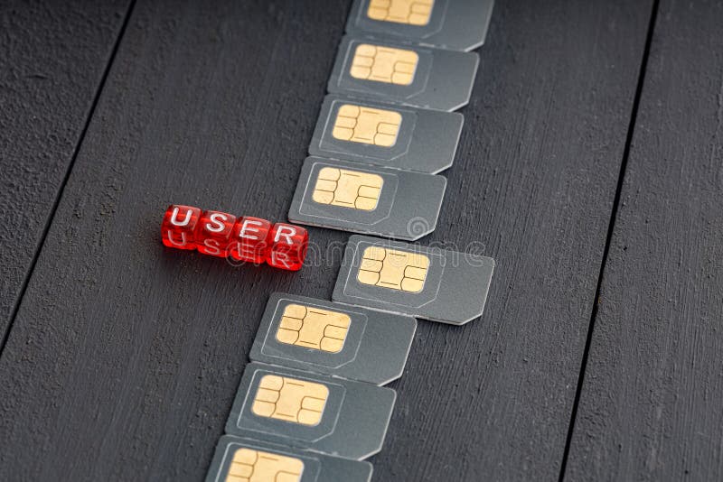 Top View of a Row of Sim Cards and Red Cubes with the Inscription User ...