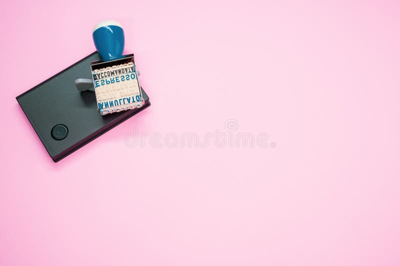 Top View of a Rubber Stamp Roller with Words on it with Ink Isolated on ...