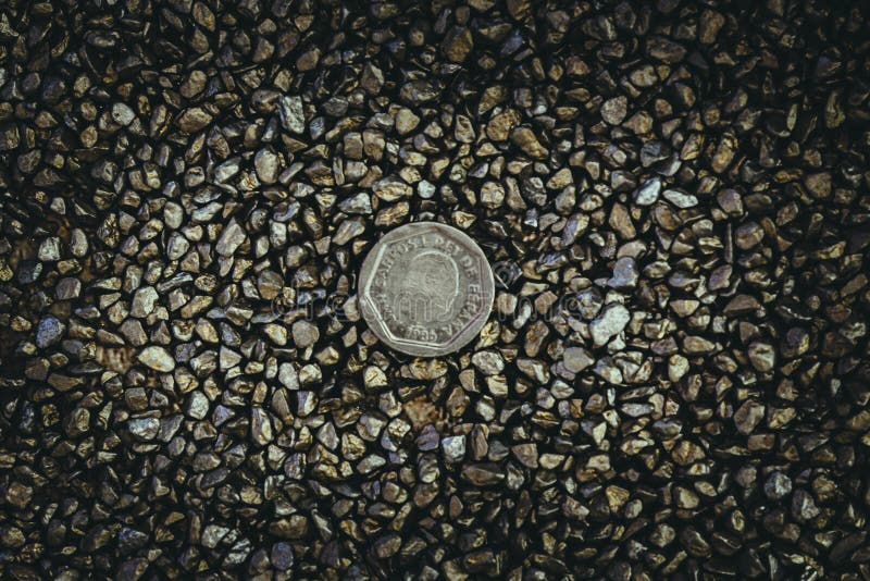 Top View of Rusty Old and Worn Out Coins Placed on the Ground with Tiny ...