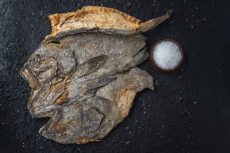 Top View of Salted Cod on a Black Stone Background with Grains of Sea ...