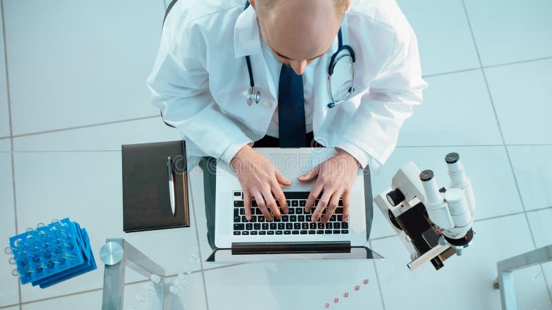 Science Lab Technician Using a Laptop during His Research. Stock Photo ...