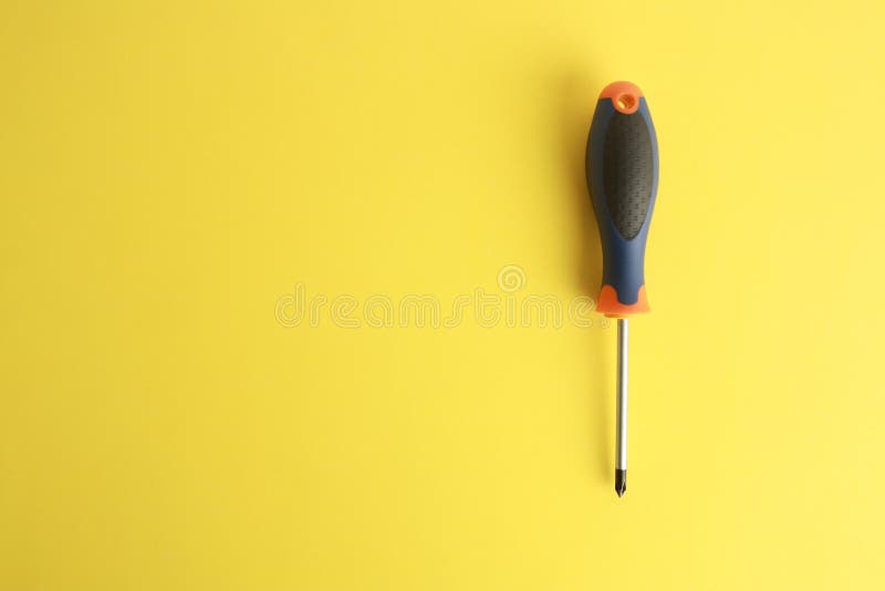 Top View of the Screwdriver on the Yellow Surface Stock Photo - Image ...