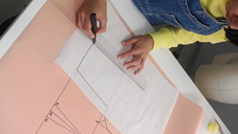 Designer Uses a Black Marker and a Ruler To Create a Design for a ...