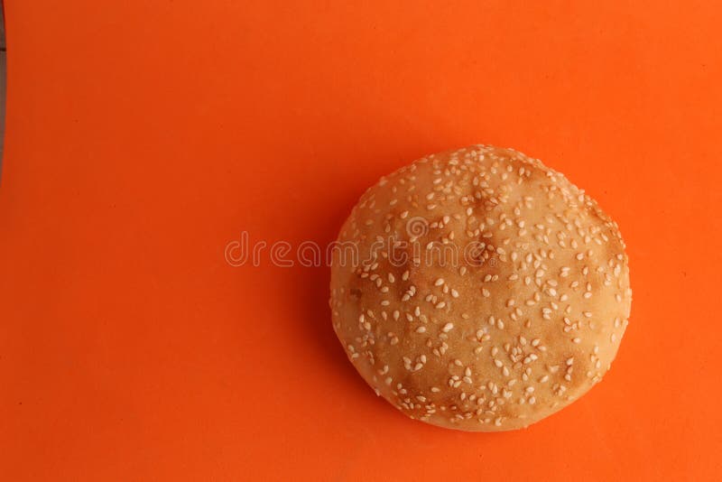 Top View of a Sesame Bun Isolated on an Orange Background Stock Photo ...