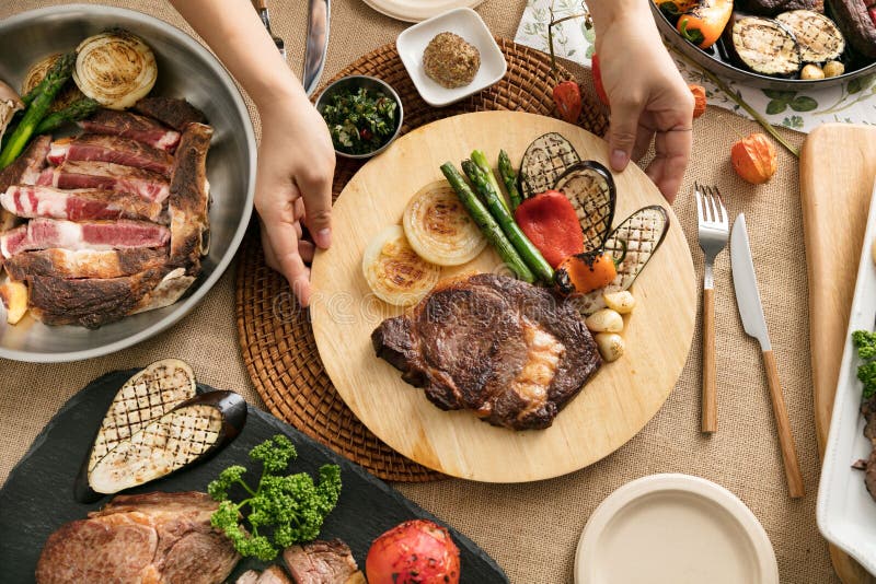 Top View of a Set Table with Steaks and Grilled Vegetables - Restaurant ...