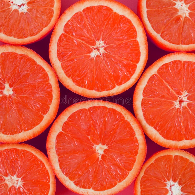 Top View of a Several Grapefruit Slices on Bright Background in Pink ...