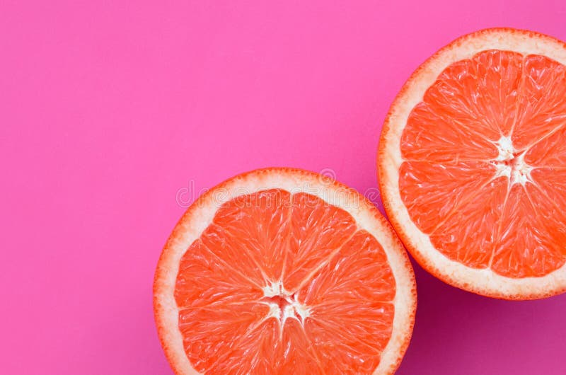 Top View of a Several Grapefruit Slices on Bright Background in Purple ...