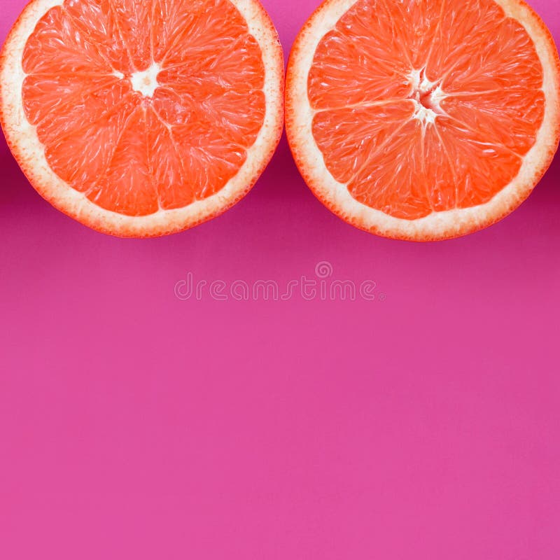 Top View of a Several Grapefruit Slices on Bright Background in Purple ...