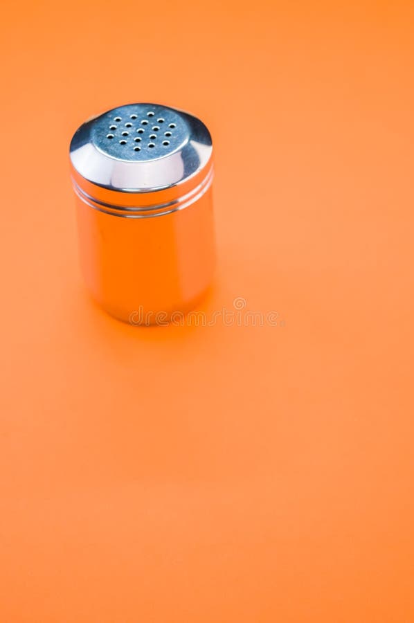 Top View of a Shaker for Different Powders on an Orange Background ...