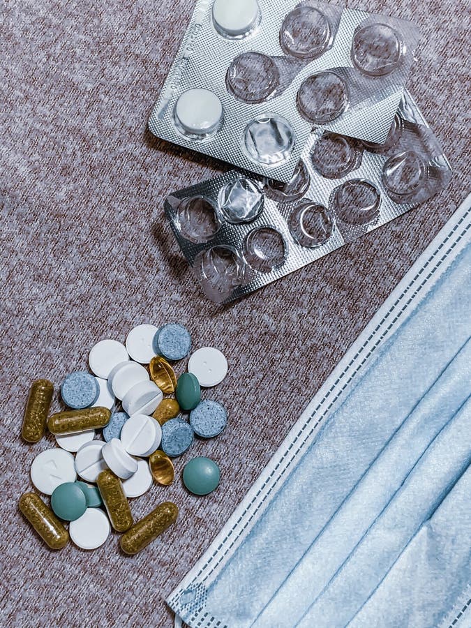 Top View Shot of Different Pills and a Facial Mask on the Table ...