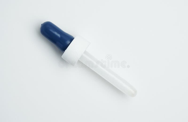 Top View Shot of a Dropper on a White Surface Stock Photo - Image of ...