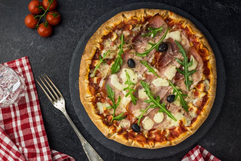 Top View Shot of a Pizza Tomate Jambon with Some Cherry Tomatoes Near ...