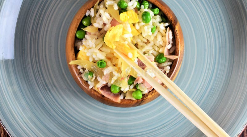 Top View Shot of a Plate Full of Rice Three Delights, and Chopsticks ...