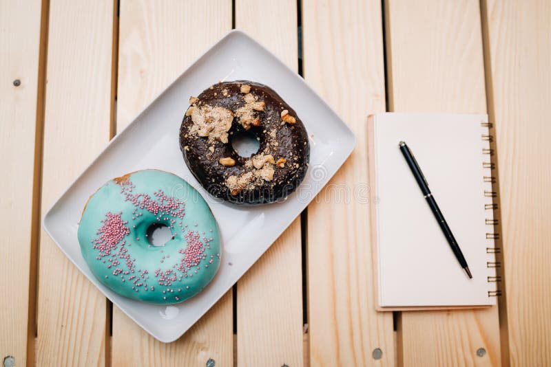 Top View Shot of Tasty Donuts on a White Rectangular Plate beside a ...