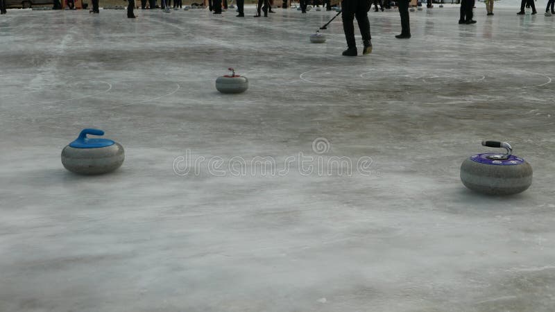 Top View Shot of Three Colored Curling Stones on Ice Stock Photo ...
