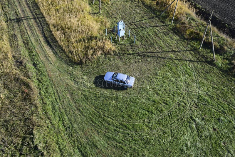 Top View of a Silver Car Standing on the Lawn. One Flew Over the Car ...
