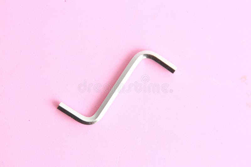 Top View of a Silver Hex Key on a Pink Surface Stock Photo - Image of ...