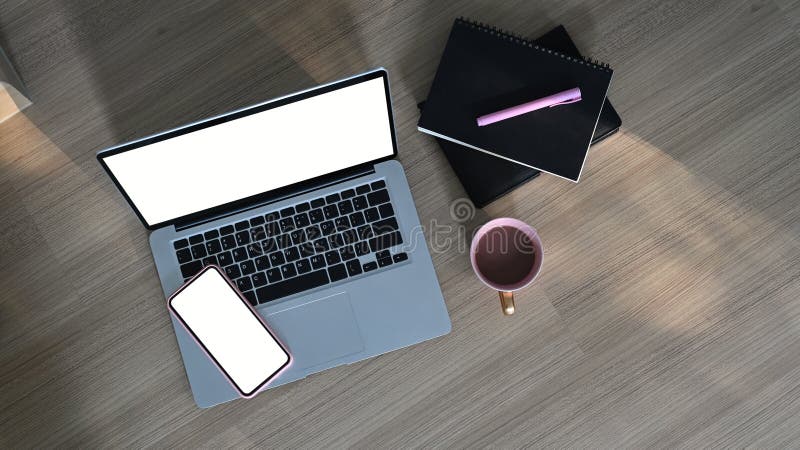 Top View of Simple Workspace with Blank Screen Laptop, Mobile Phone ...