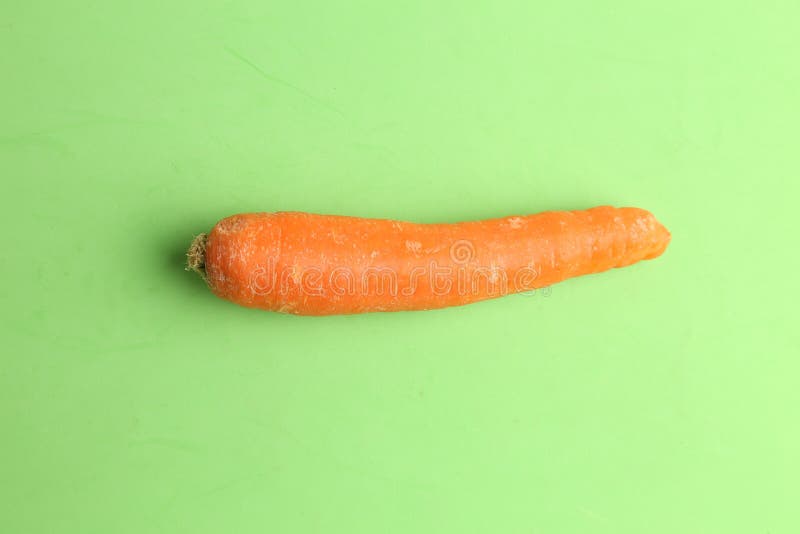 Top View of a Single Delicious Carrot on a Green Surface Stock Image ...