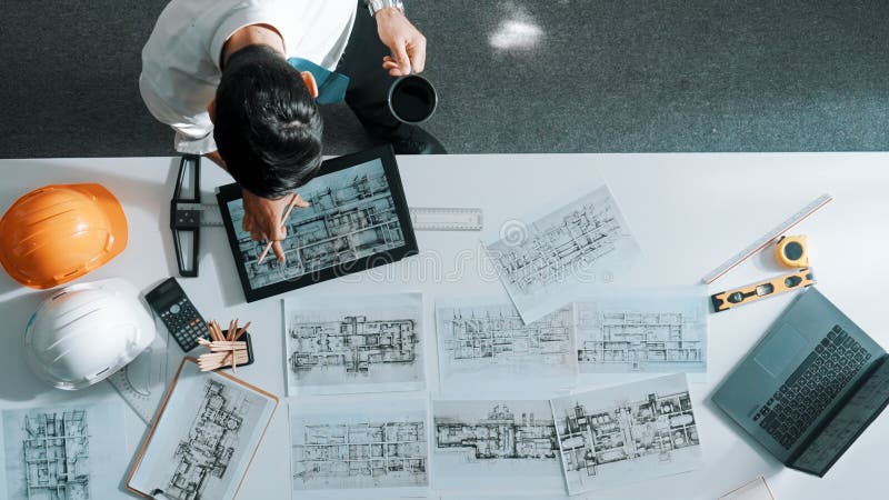 Top View of Skilled Architect Looking at Project Plan at Tablet ...