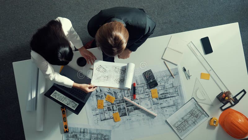 Top View of Manager Holding Project Plan and Explain House Design ...