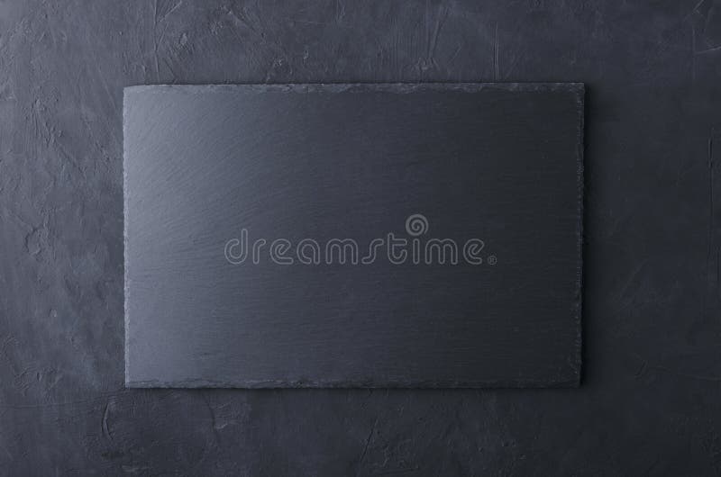 Top View of Slate Table Mat on the Black Surface.Empty Space for Design ...
