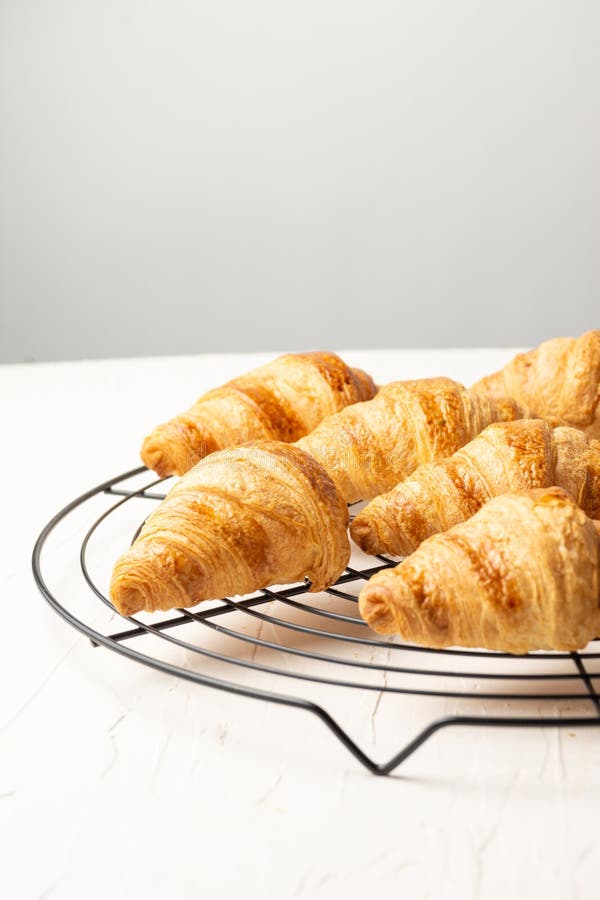 Top View of Small Croissants on Rack on White Table, Selective Focus ...