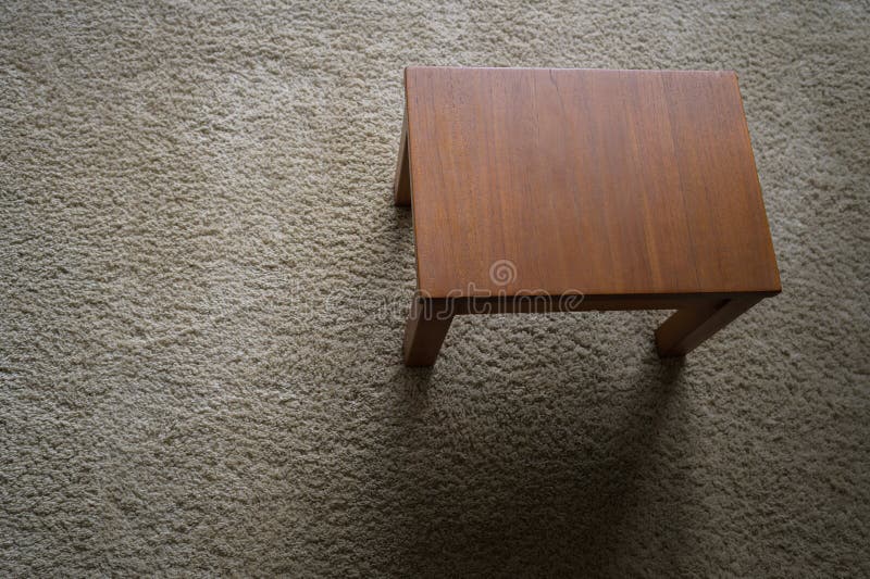 Top View of Small Teak Table on Beige Carpet. Stock Photo - Image of ...