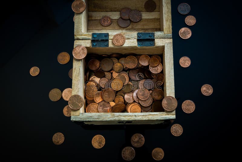 Top View of a Small Wooden Treasure Chest with Many Different Coins ...