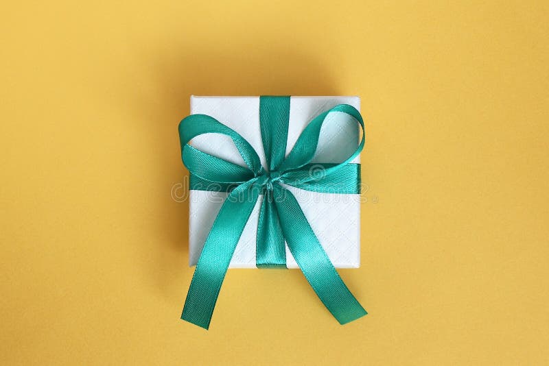 Top View Small Wrapped Gift Box Turquoise Ribbon Yellow Background ...