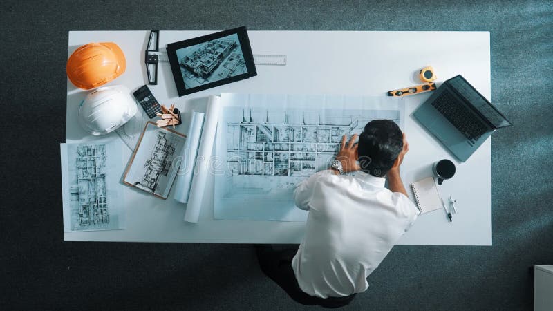 Top View of Smart Civil Engineer Drawing and Measuring Blueprint ...