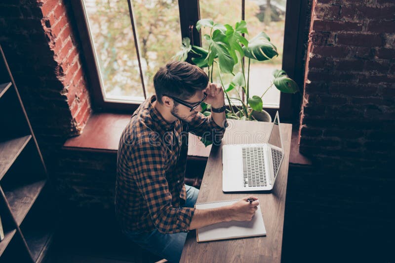 Top View of Smart Guy Working on Laptop and Making Notes Stock Photo ...